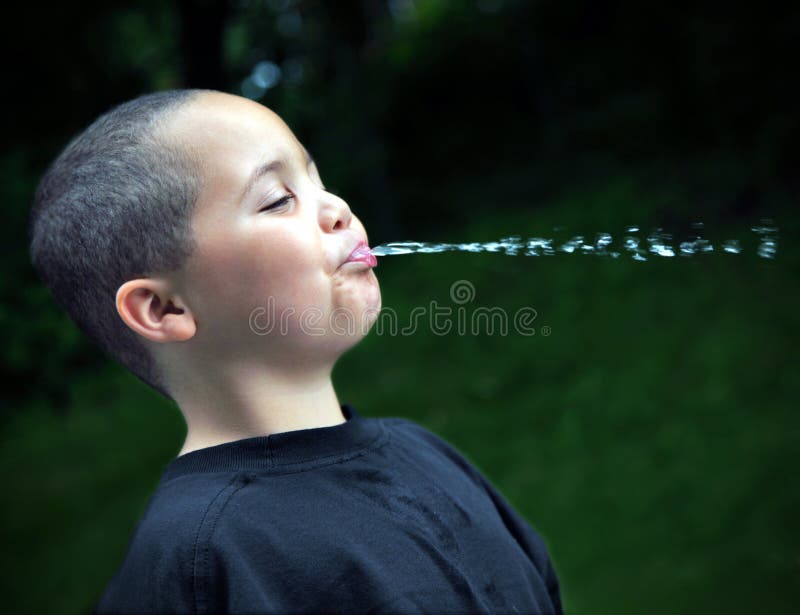 Latino boy spitting water stock image. Image of outddors - 12926815