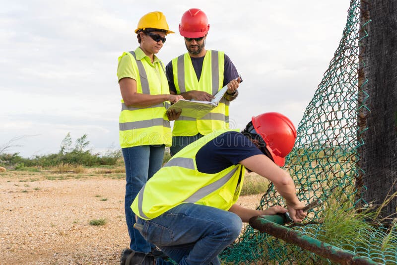 Latino Industrial Workers at Work in Front of a Refinery Stock Image ...