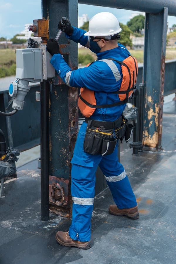 Latino Marine Engineering Officer on the Ship with Protective Mask ...