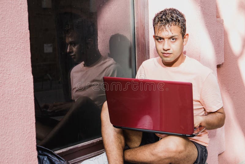 Hispanic boy with laptop. stock image. Image of smiling - 222309413