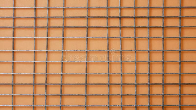 Lattice Made of Metal Thin Wire Sits Against Orange Background. Grid ...
