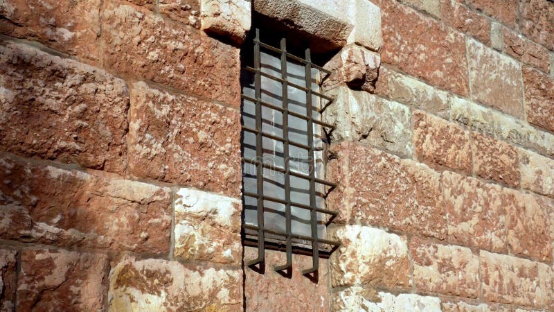 Prison Building Wall with Barred Windows of Prison Cells Behind an Iron ...