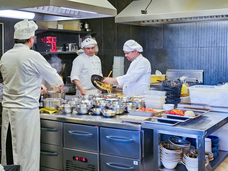 Restaurant Chefs Work in the Modern Kitchen of an Asian Restaurant in ...