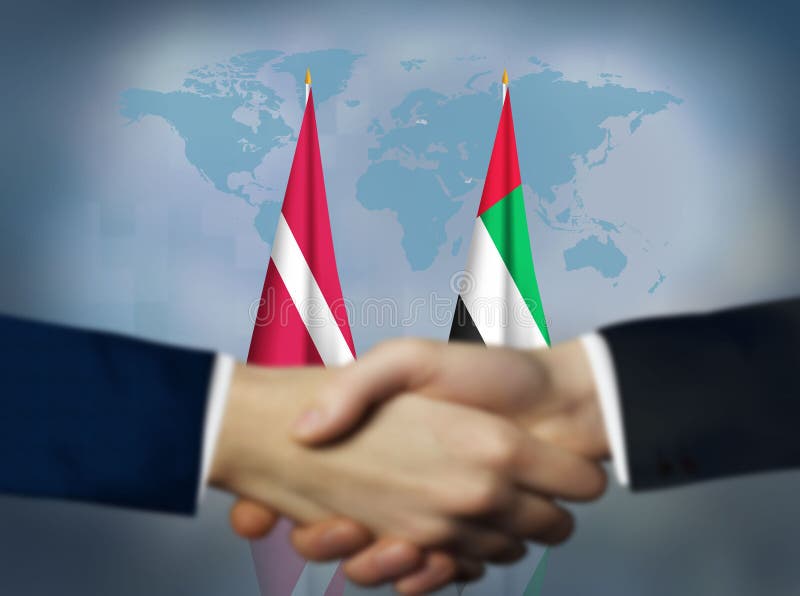 Two People Shaking Hands in Front of UAE and Latvia Flags Stock ...