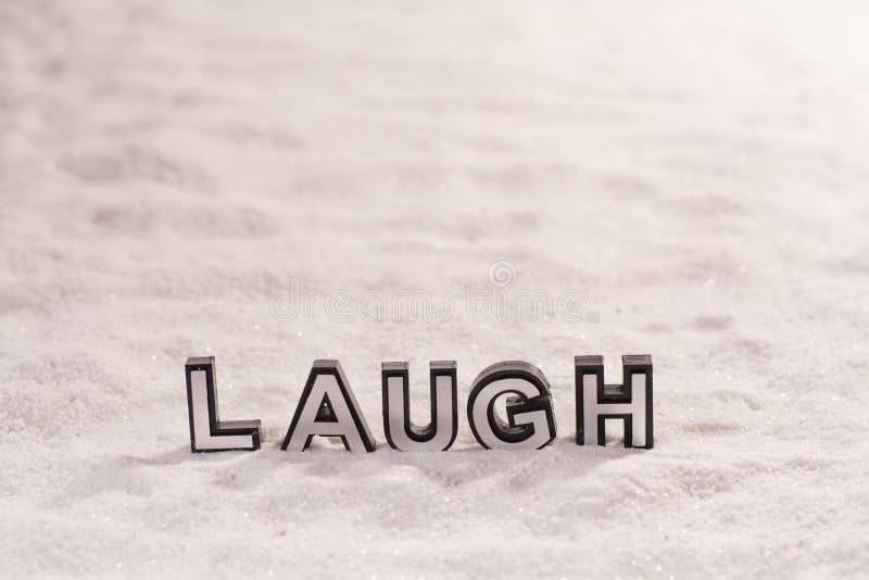 Laugh word on white sand stock photo. Image of laughing - 119344536