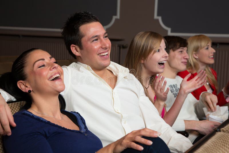 Laughing Audience at the Movies Stock Photo - Image of friends ...