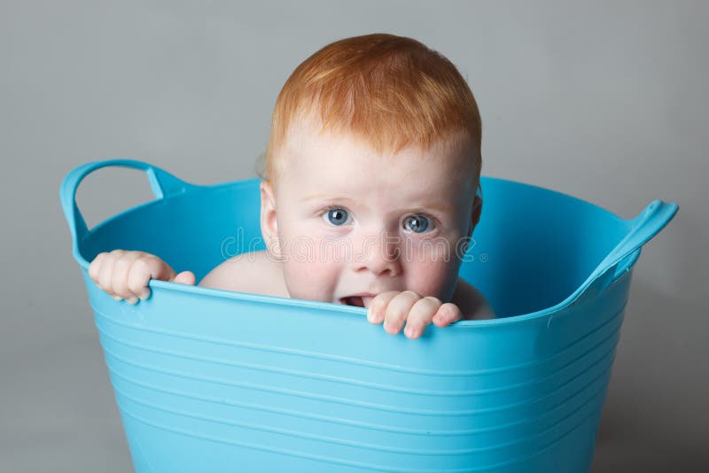 Laughing Baby in a Blue Bucket Stock Image - Image of person, looking ...