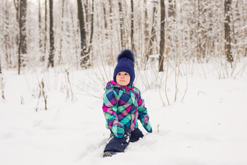 Laughing Baby Girl Playing in the Snow Stock Photo - Image of laughing ...