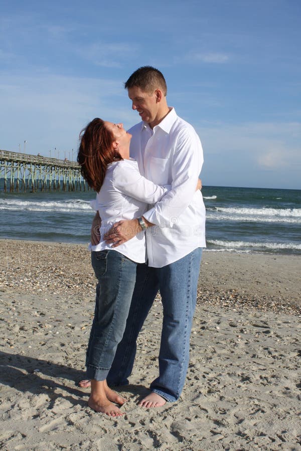 Laughing on the beach too stock image. Image of happy - 9438897