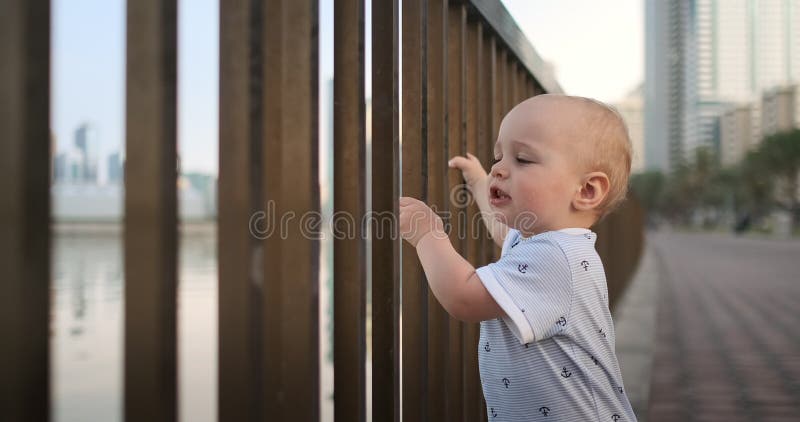 Laughing Boy Dancing Holding on To the Railing Stock Video - Video of ...