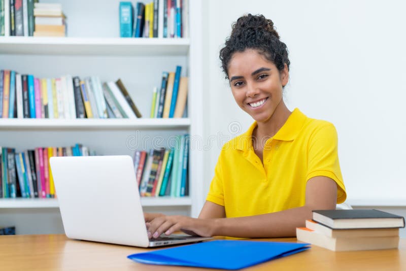Laughing Brazilian Female Student Learning at Computer Stock Image ...