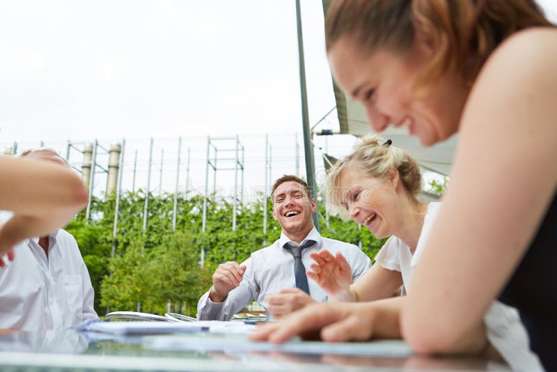 Laughing Business People on a Table Stock Image - Image of ...