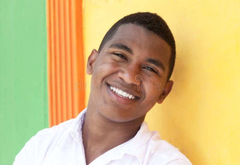 Laughing Caribbean Guy in Front of a Colorful Wall Stock Photo - Image ...