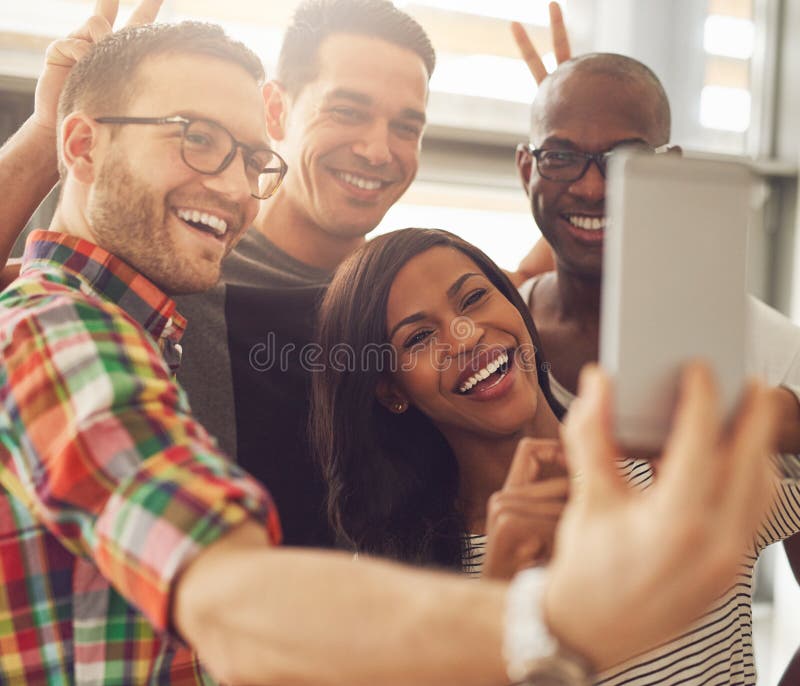 Laughing Co-workers Taking Self Portrait Stock Image - Image of ...