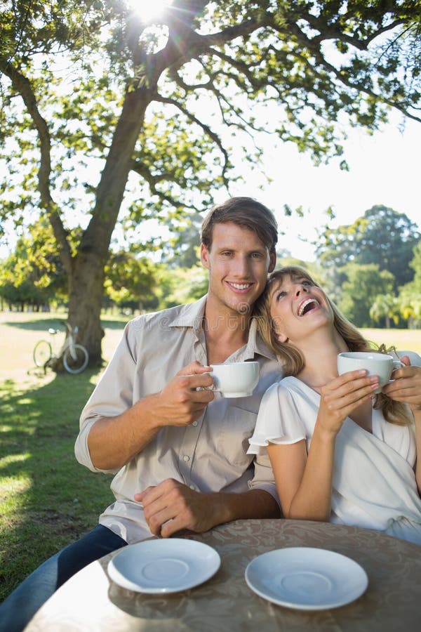 Laughing Couple Having Tea Outside in a Cafe Stock Photo - Image of ...