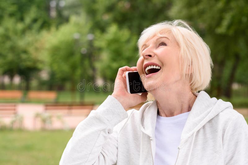 Laughing Elderly Woman Talking Stock Photo - Image of person, elderly ...