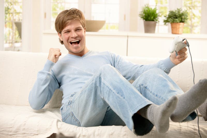 Laughing Guy with Computer Game Stock Photo - Image of happy, bright ...