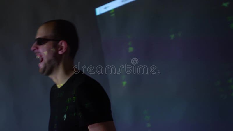 Laughing Hacker with Binary Codes from Monitor Stock Video - Video of ...