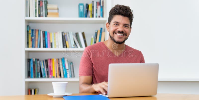 Laughing Latin American Man with Beard Working at Computer Stock Image ...