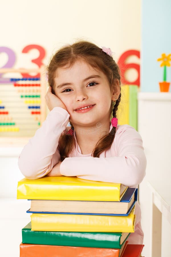 Little girl with books stock image. Image of equipment - 30090141