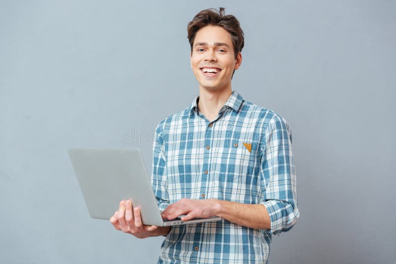 Laughing Man Standing with Laptop Computer Stock Photo - Image of ...