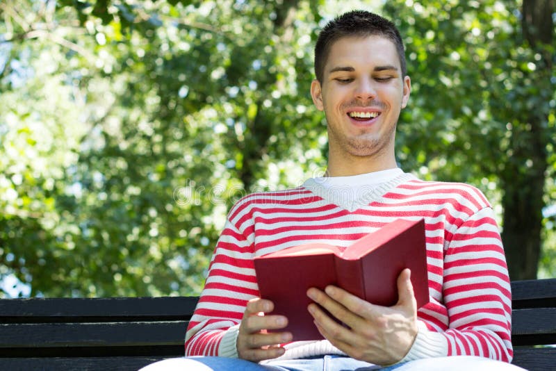 Laughing Out Loud and Reading a Book Stock Photo - Image of leisure ...