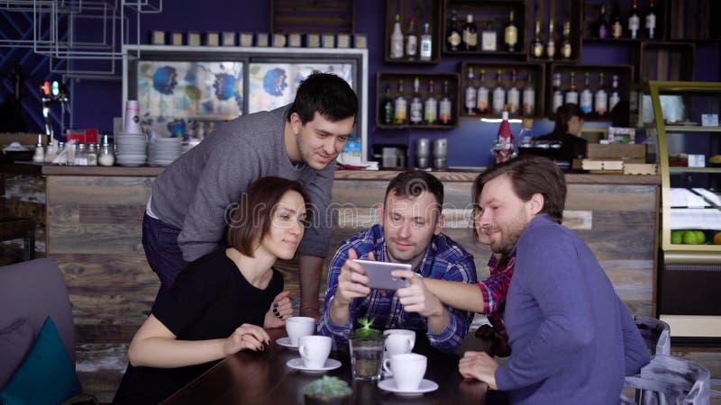 Laughing People Watching Phone Together Stock Video - Video of reunion ...