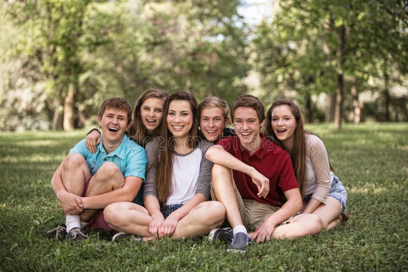Laughing Teens Outdoors stock photo. Image of embracing - 45558836