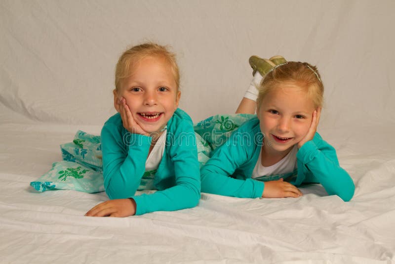 Laughing twins stock photo. Image of laugh, sisters, pose - 25096630