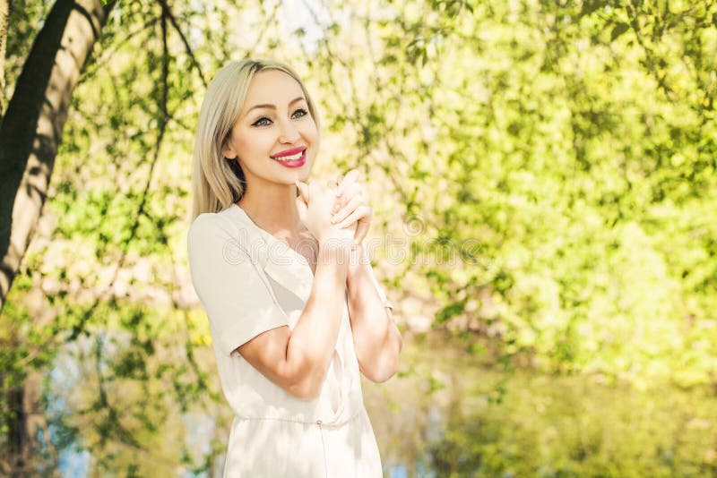Laughing Woman Having Fun Outdoors On Green Foliage Leaves Stock Image