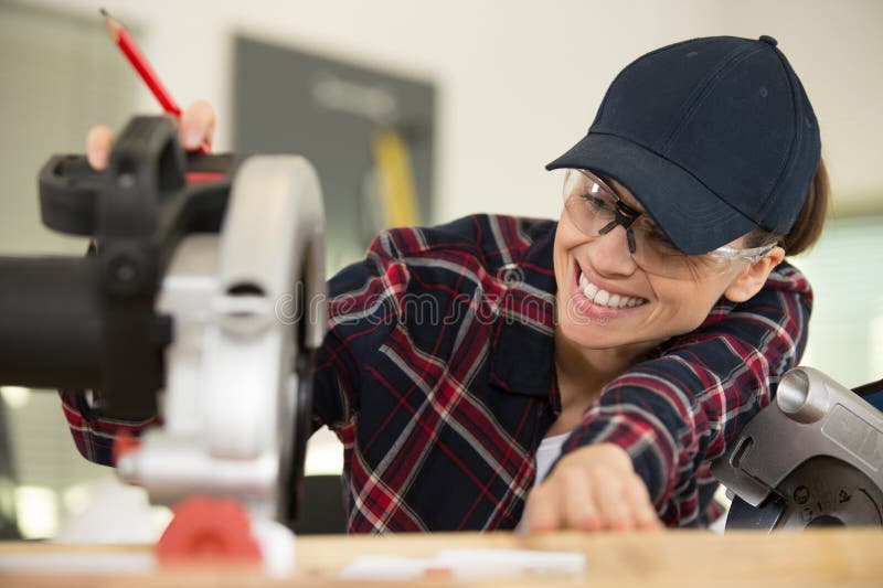 Laughing Woman Using Circular Saw Stock Photo - Image of laughing ...