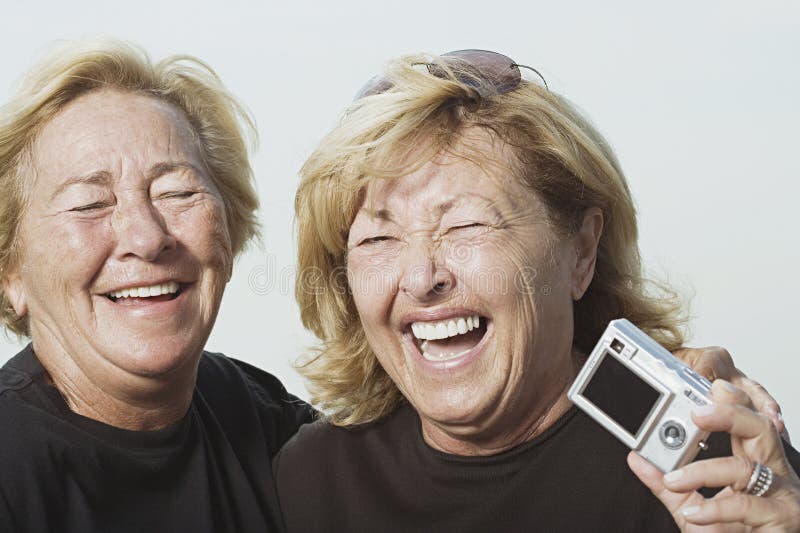 Laughing Women with Digital Camera Stock Photo - Image of memory, heart ...
