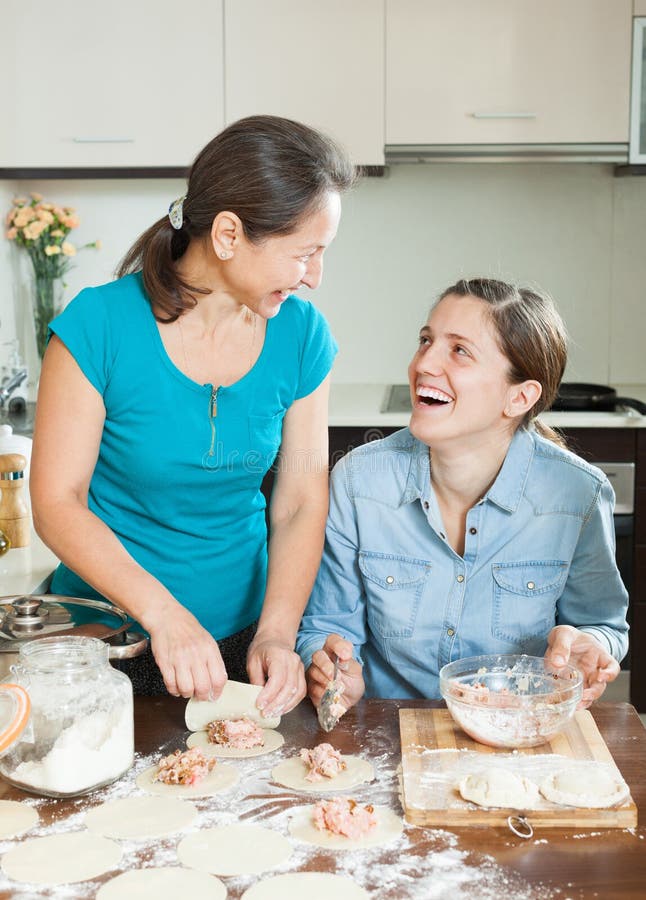 Laughing Women Making Pies Together Stock Photos - Free & Royalty-Free ...