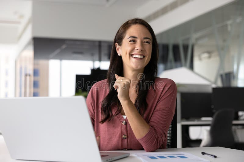 Laughing Young Businesswoman Working with Statistics on Notebook Look ...