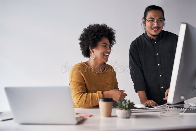 Laughter is Essential for Good Teamwork. a Two Young Coworkers Working ...