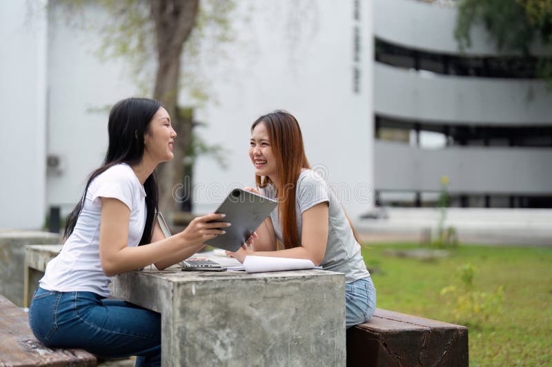 Laughter and Learning. Two Friends Sharing a Joyful Moment Over Their ...