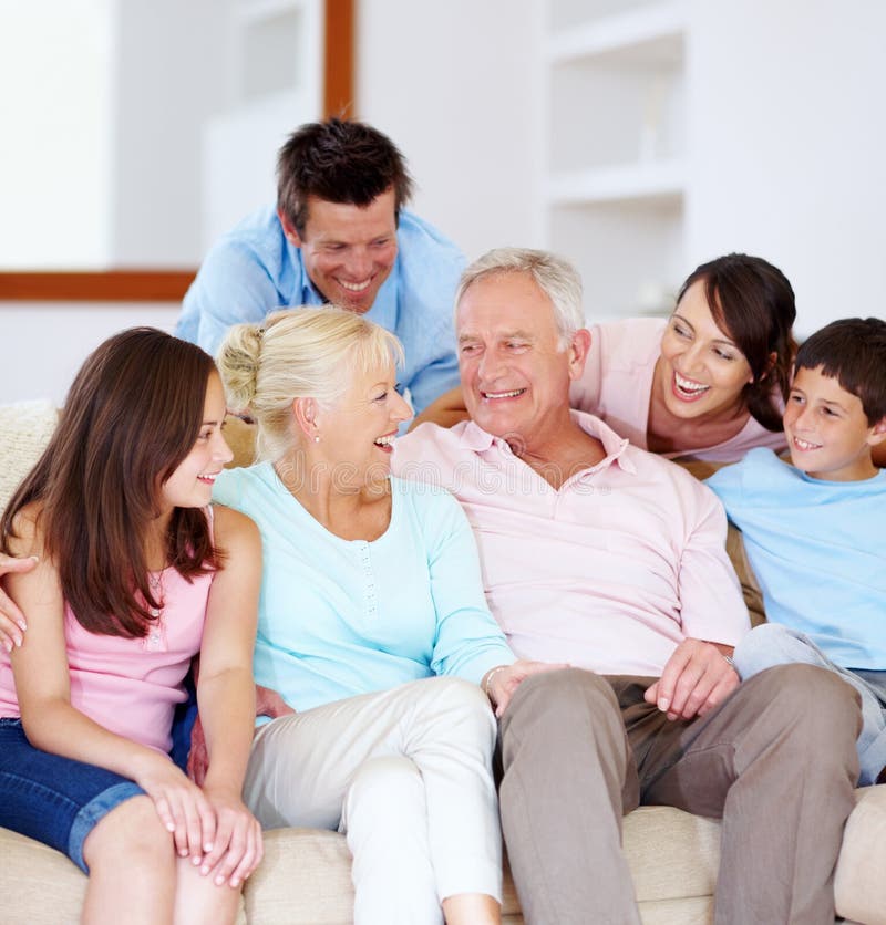 Laughter, Love and Affection. a Loving Family Laughing on a Lounge Sofa ... Laughter, Love and Affection. a Loving Family Laughing on a Lounge Sofa ...
