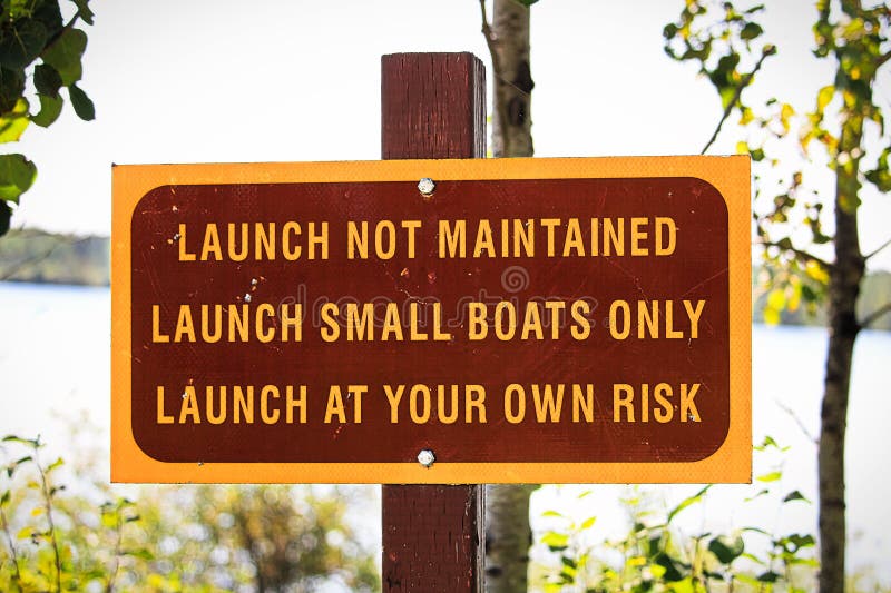 A Launch Not Maintained Use at Own Risk Sign Stock Photo - Image of ...