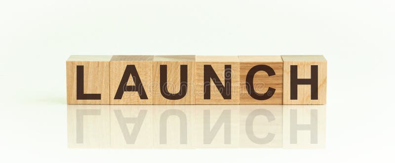 Word Launch on Keyboard Background, Word Made with Wooden Blocks Stock ...