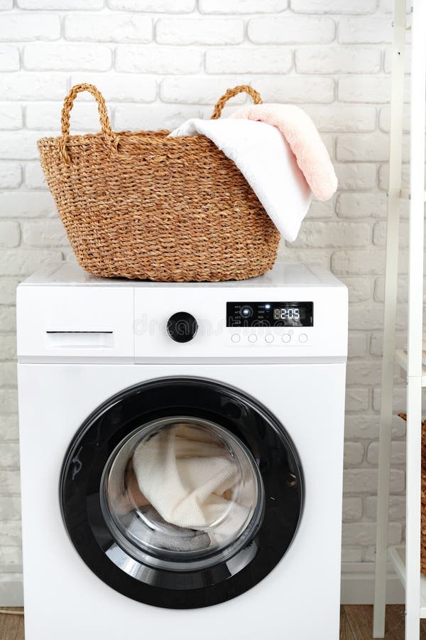 Laundry Basket on Washing Machine in a Laundry Room Stock Image - Image ...