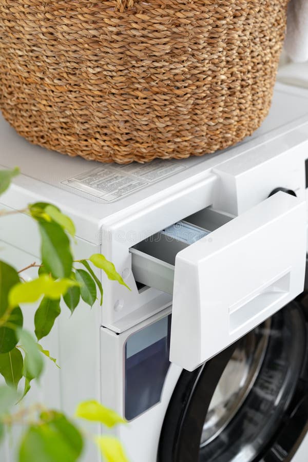 Laundry Basket on Washing Machine in a Laundry Room Stock Image - Image ...