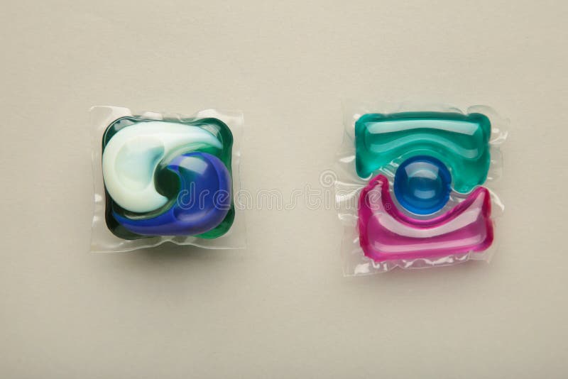 Laundry Capsule Detergent Pods for Washing Clothes on Grey Background ...