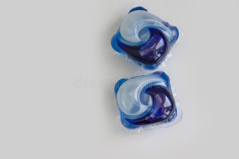 Laundry Capsules on a Light Background Machine Stock Image - Image of ...