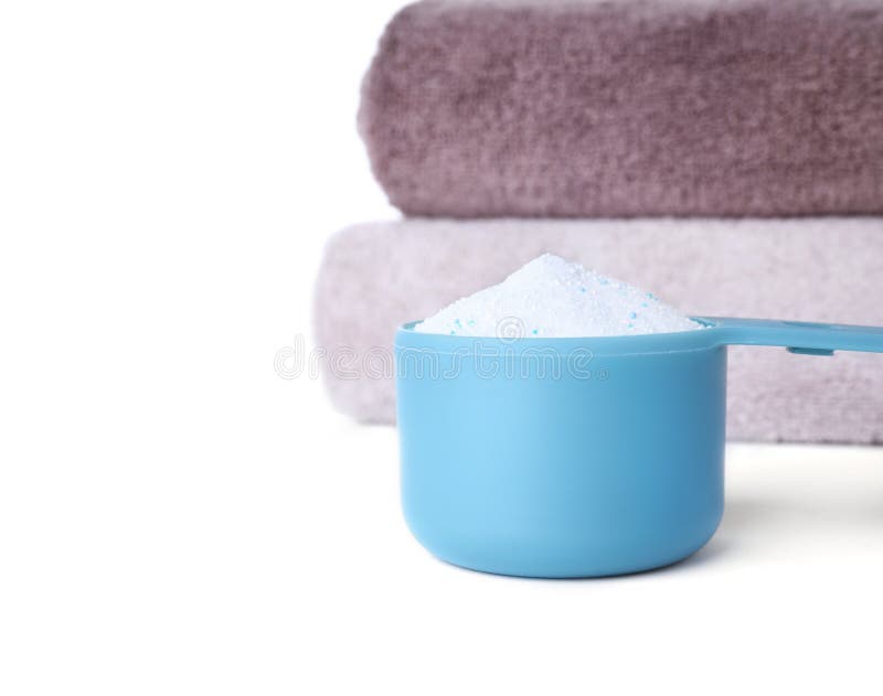 Laundry Detergent in Plastic Measuring Scoop and Towels on White Stock ...
