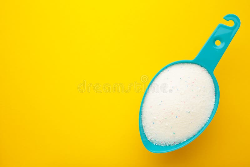 Laundry Detergent Powder for Washing Machine in Plastic Scoop on Yellow ...