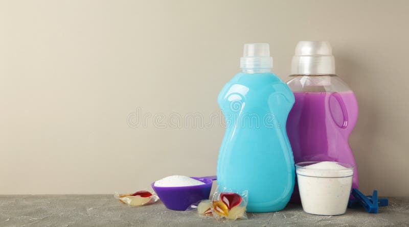 Laundry Detergents with Washing Powder and Capsules on Grey Background ...