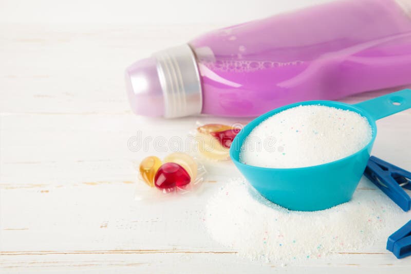Laundry Detergents with Washing Powder and Capsules on Blue Background ...