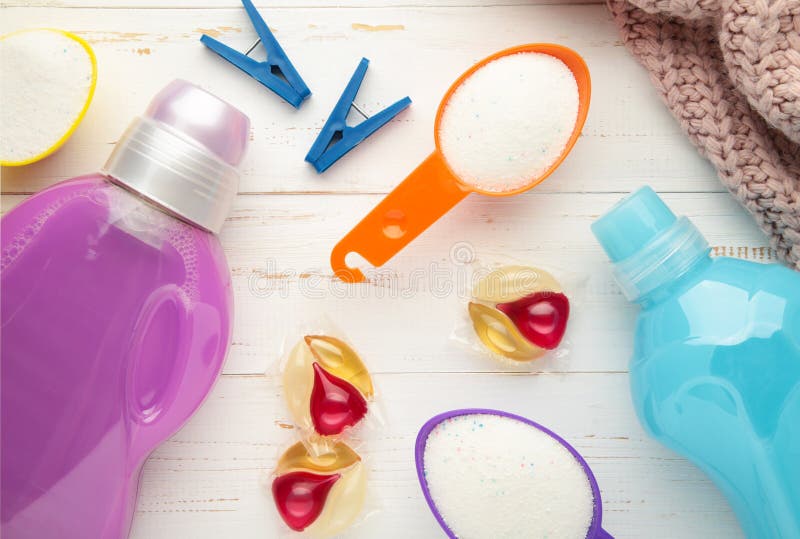 Laundry Detergents with Washing Powder and Capsules on Grey Background ...