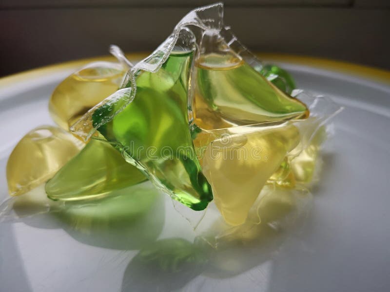 Laundry Detergents with Washing Powder and Capsules on Grey Background ...