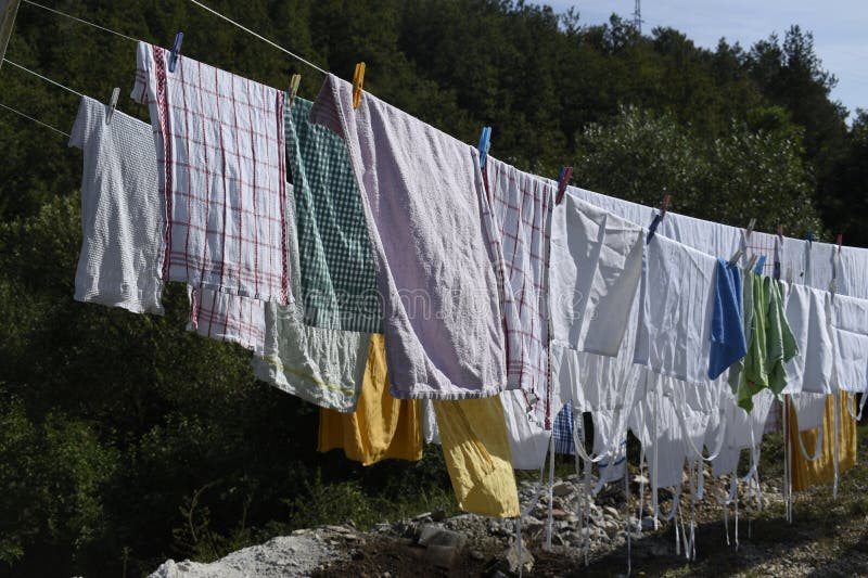 Laundry Drying on the Line in Front of the Forest Stock Photo - Image ...